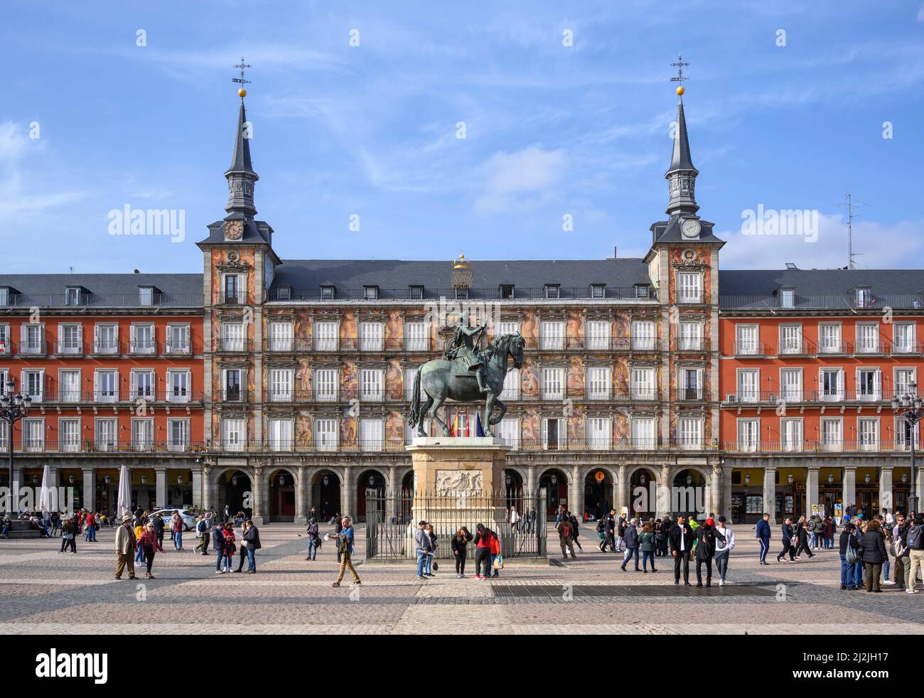 Visitors and Equestrian statue of King Felipe III in Plaza Mayor in ...