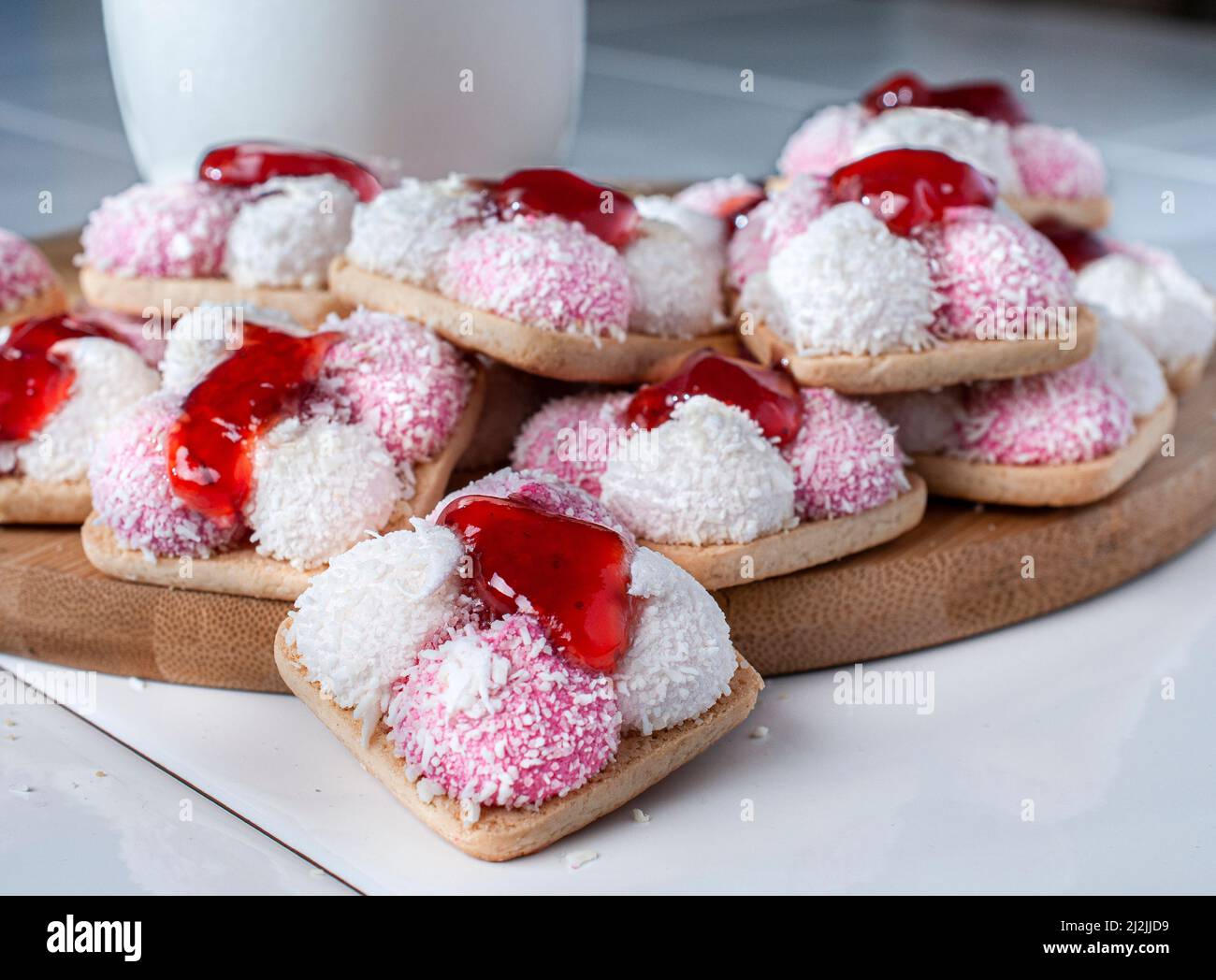 cookies with marshmallow, dried coconut flakes and strawberry jam, with ...