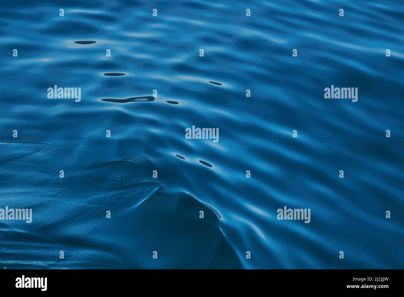 A beautiful shot of blue real sea water ripple in the sea Stock Photo ...
