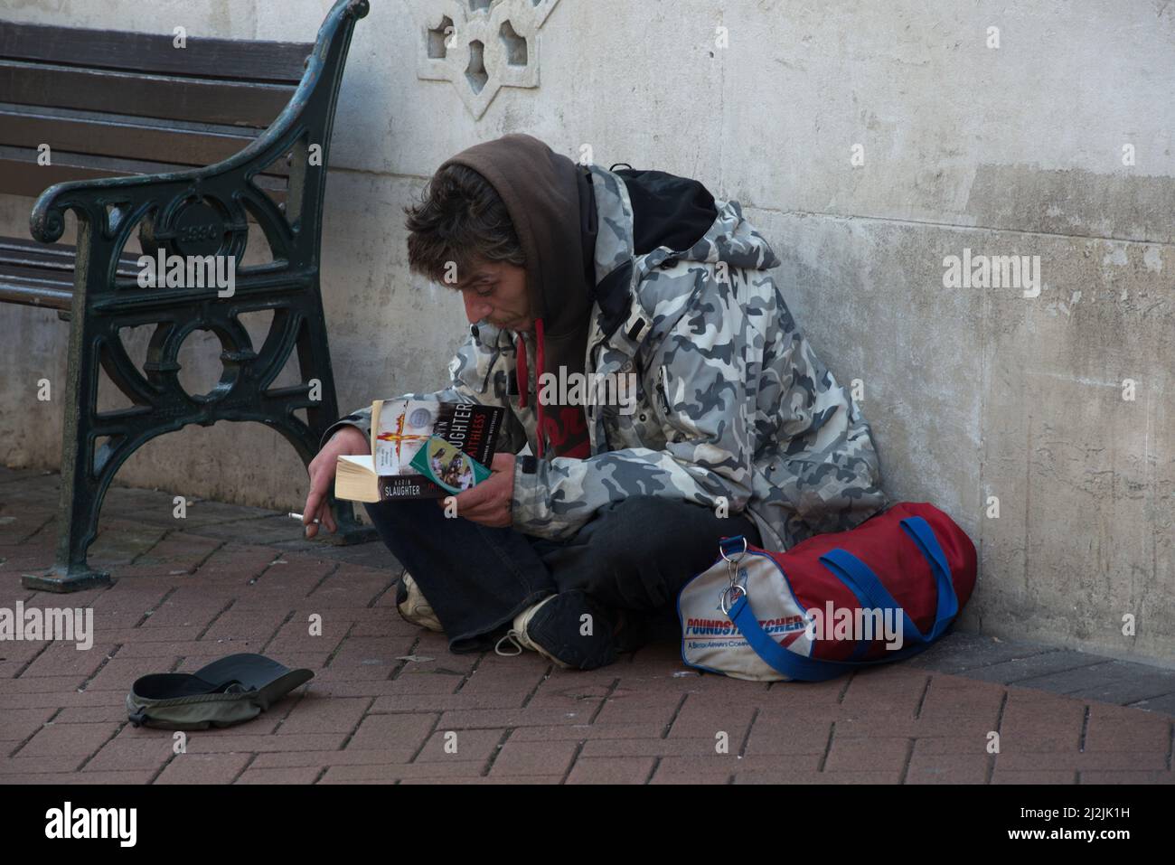 Homeless man smoking cigarette hi-res stock photography and images - Alamy