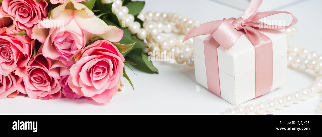 Box with pink ribbon Stock Photo - Alamy