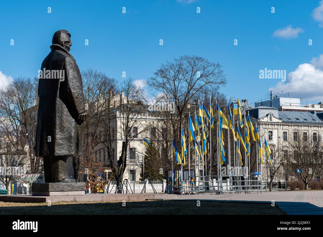 A group of Ukrainian flags waving in front of the Riga Congress Centre ...