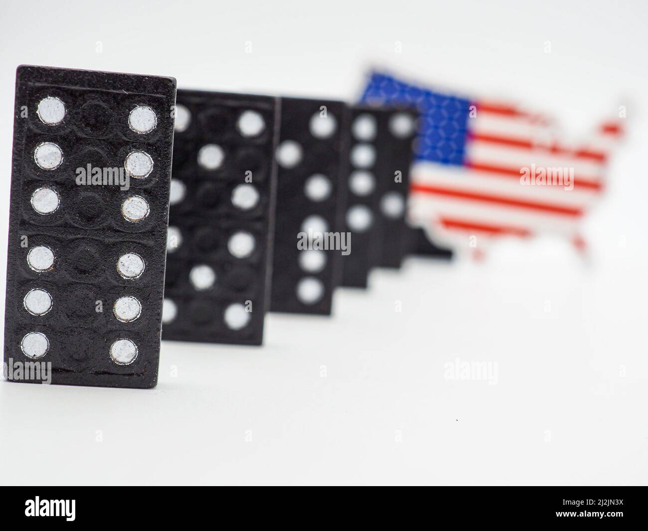conceptual domino effect and american map with flag Stock Photo - Alamy