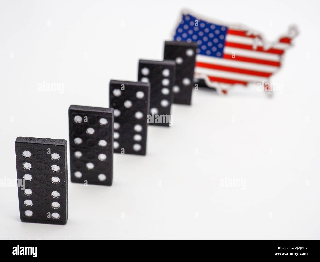 conceptual domino effect and american map with flag Stock Photo - Alamy