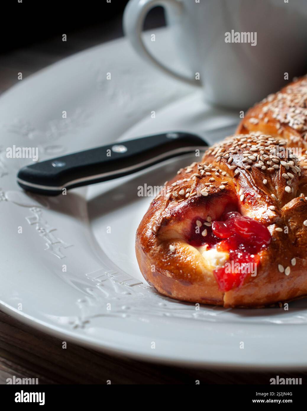 Sweet bread stuffed with strawberry jam and cheese, with sesame seeds ...