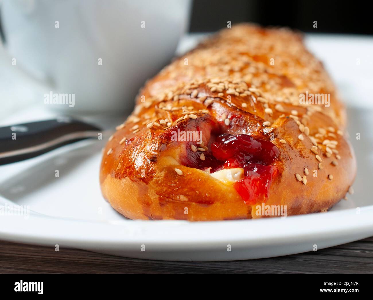Sweet bread stuffed with strawberry jam and cheese, with sesame seeds ...