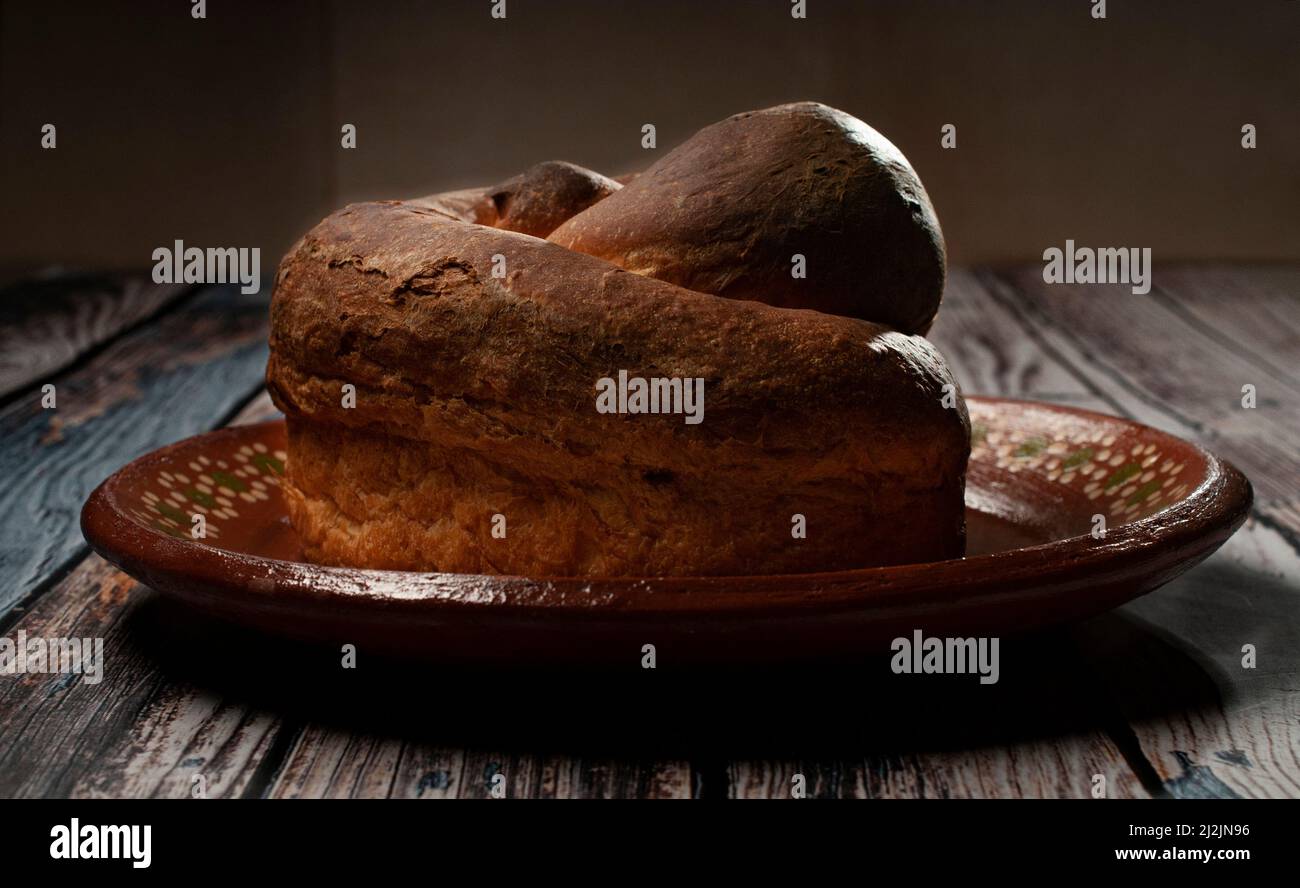 Mexican Oaxaca sweet bread stuffed with chocolate on a mud mexican ...