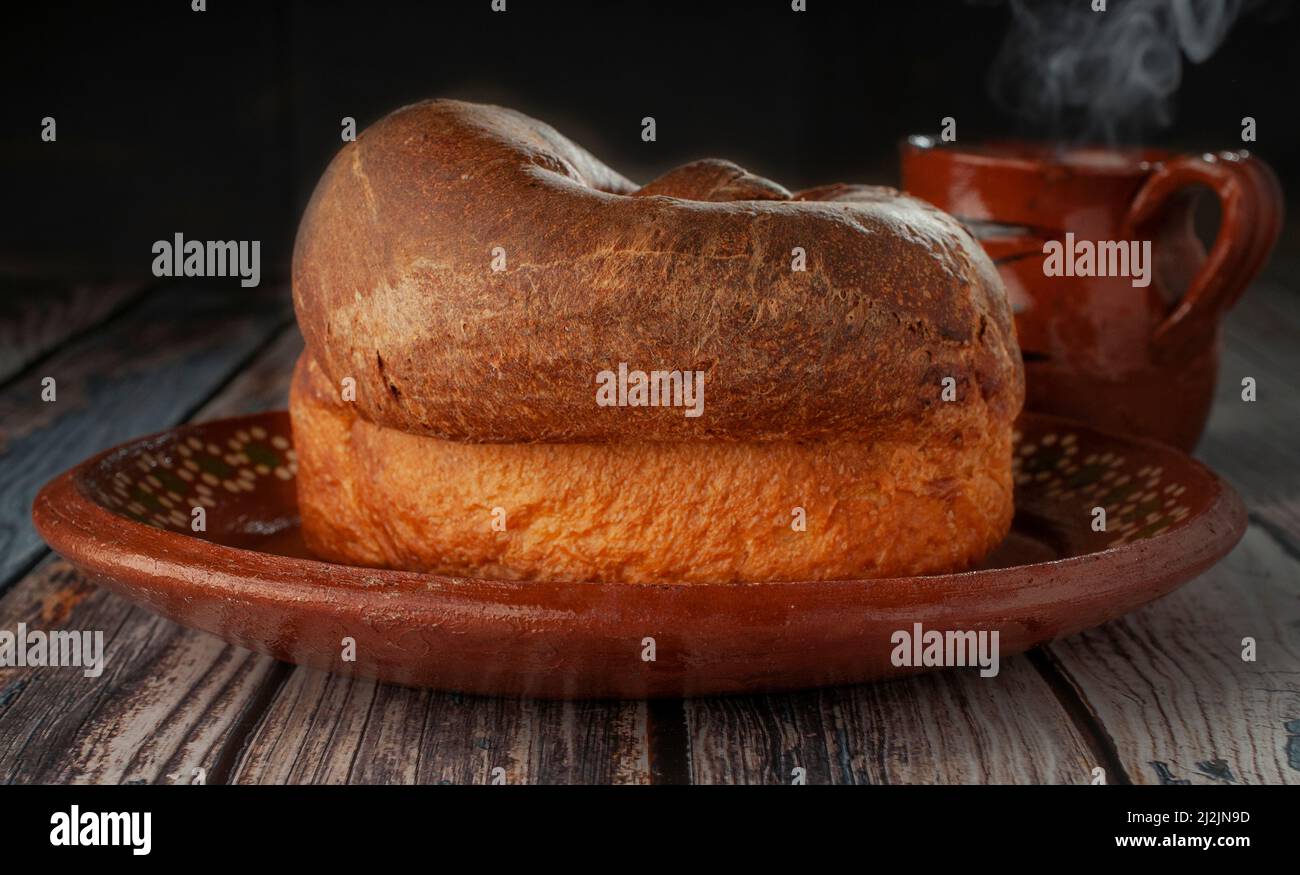 Mexican Oaxaca sweet bread stuffed with chocolate on a mud mexican ...