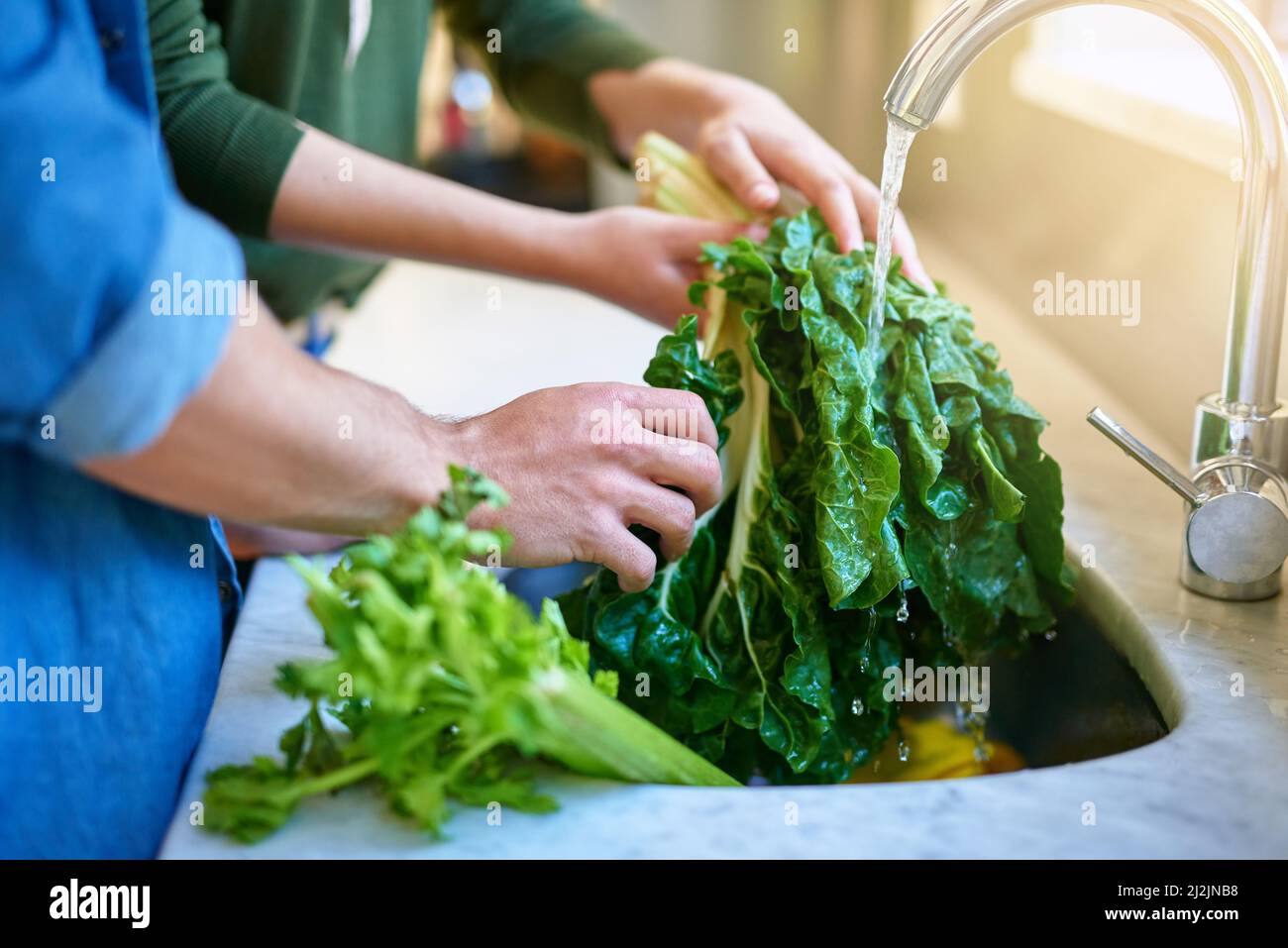 Man washing fresh vegetables in hi-res stock photography and images - Alamy