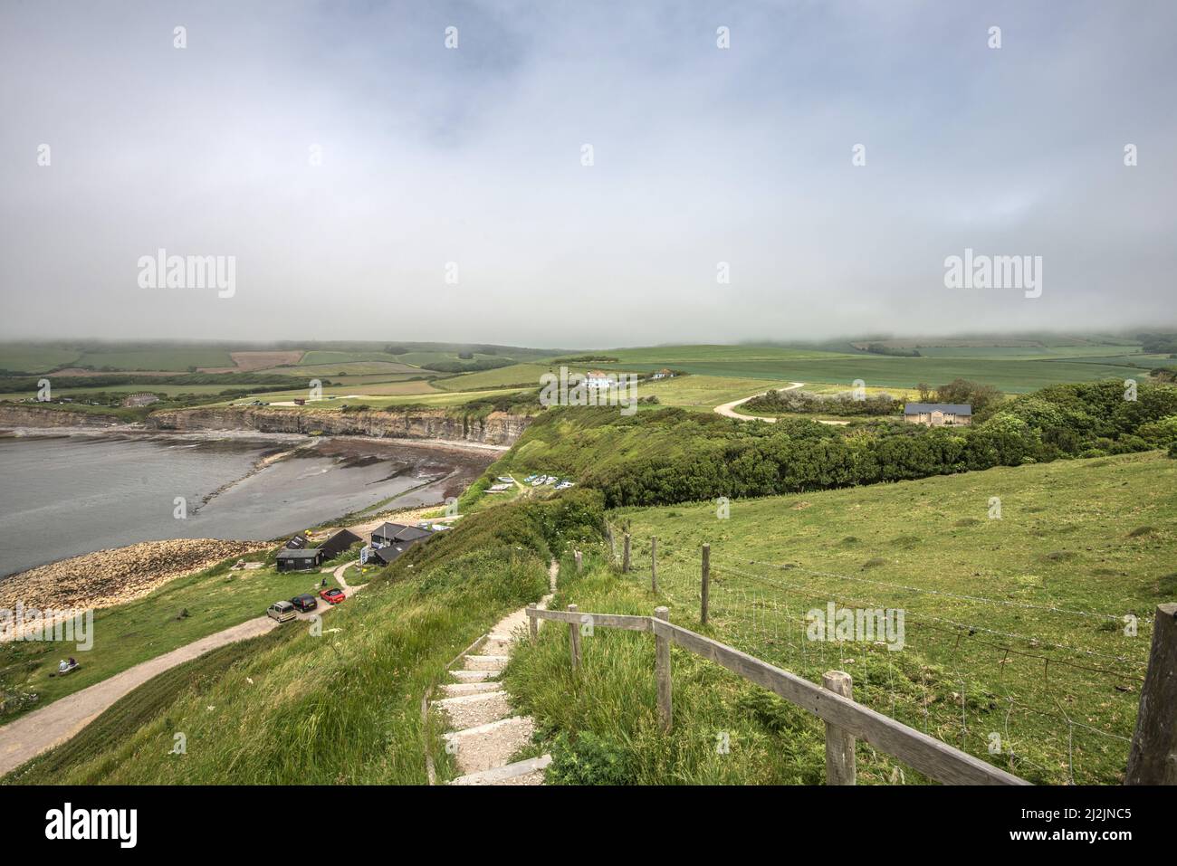 Steps leading down to Kimmeridge Beach from Clavell Tower Stock Photo ...