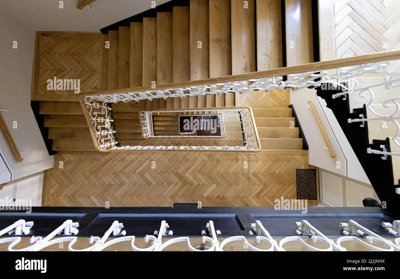 A top view of a staircase with wooden floor and white balustrade Stock ...