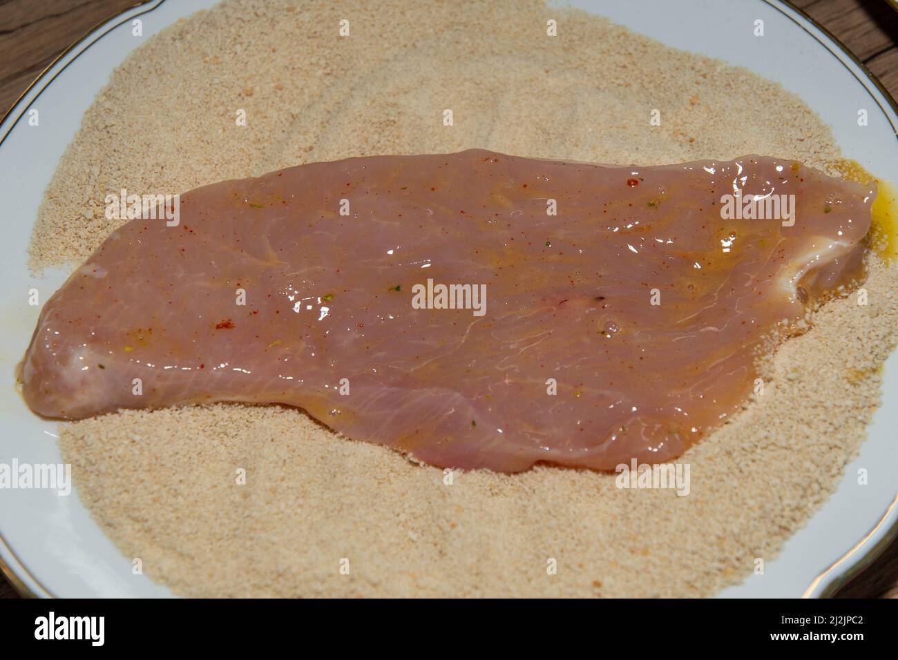 Turkey escalope breaded in breadcrumbs Stock Photo - Alamy