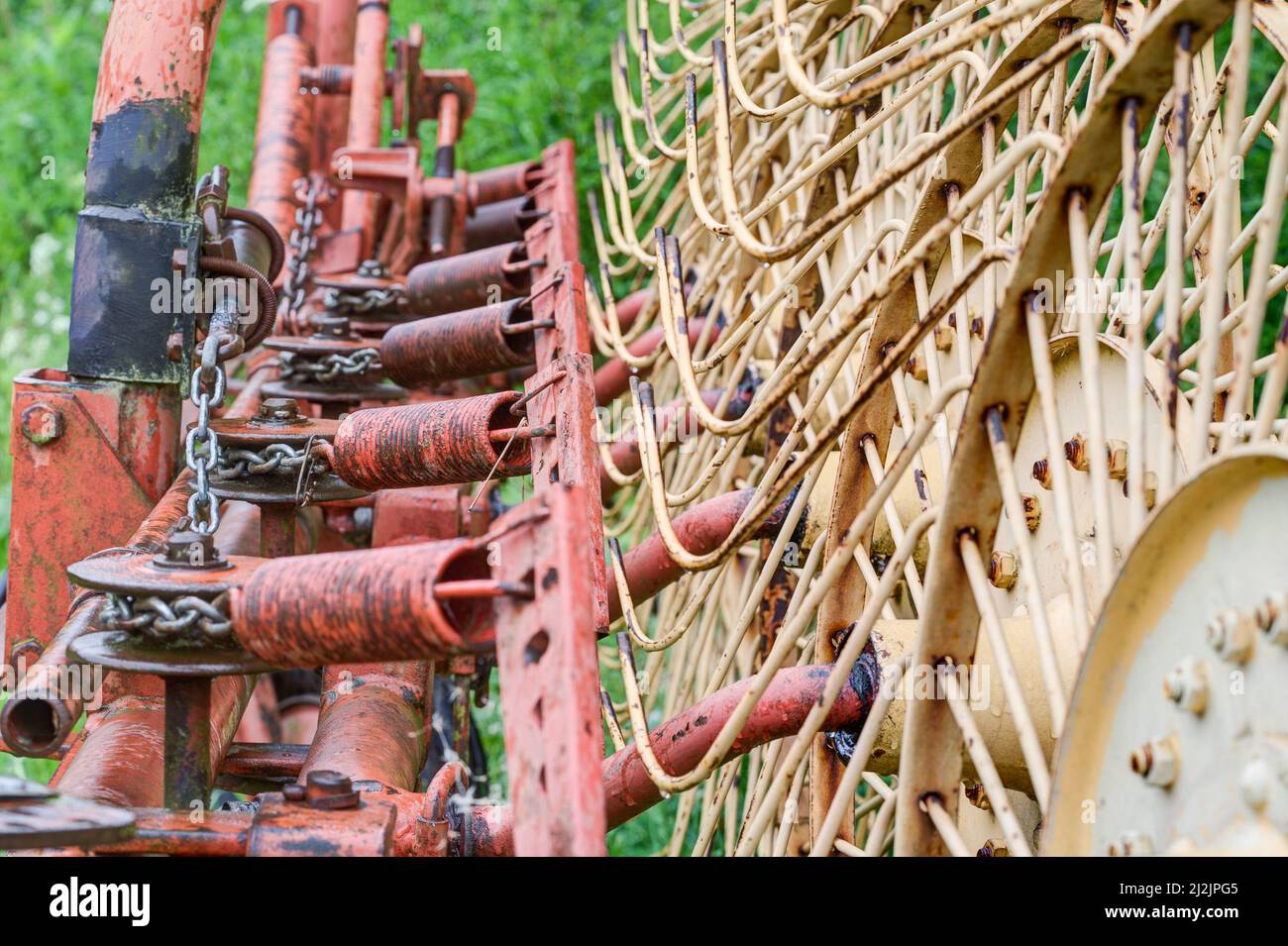 Old, solid technology. Spring tension on a star wheel rake Stock Photo ...