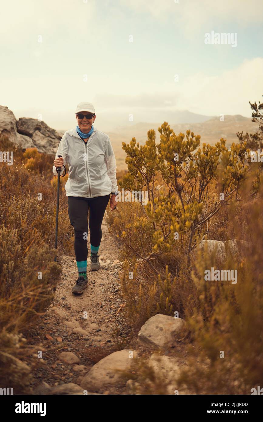 Are we there yet. Shot of a mature woman hiking in nature Stock Photo ...