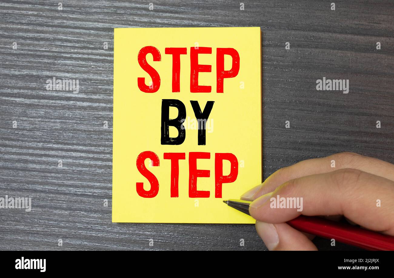 Step by step text on paper, business concept Stock Photo - Alamy