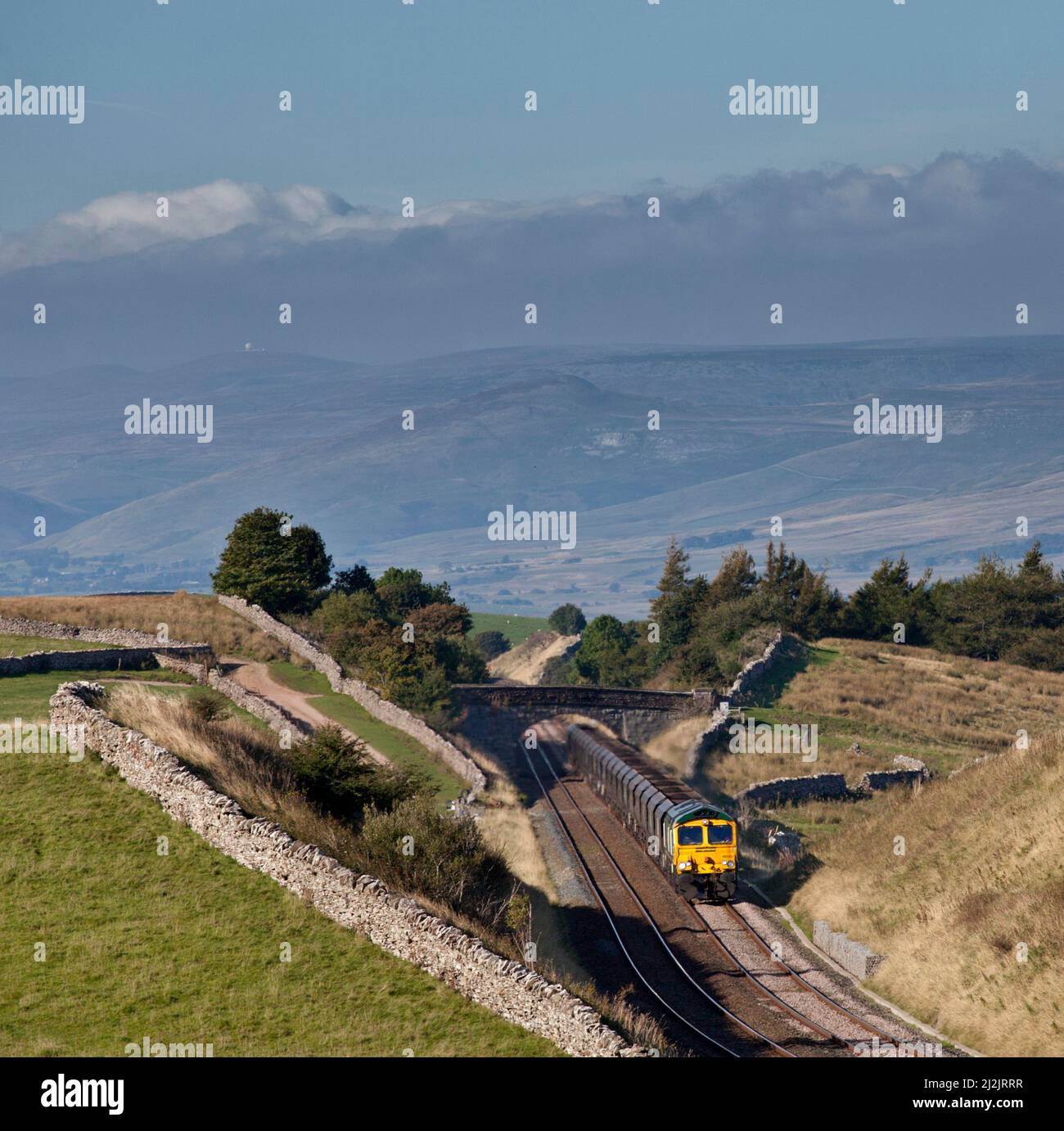 Freightliner class 66 locomotive 66951 hauling a merry go round coal ...