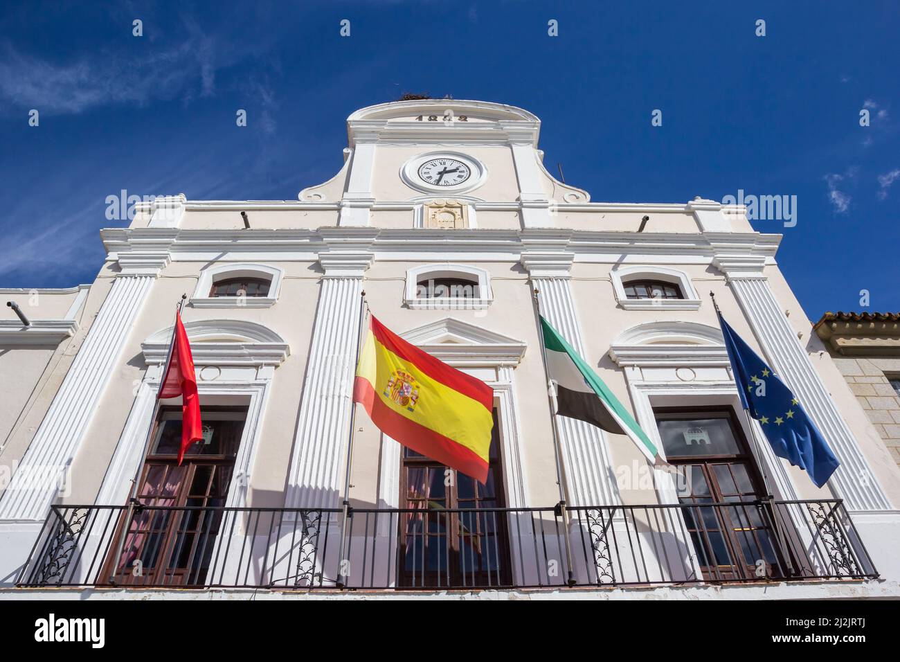 Flags at the facade of the historic town hall in Merida, Spain Stock ...