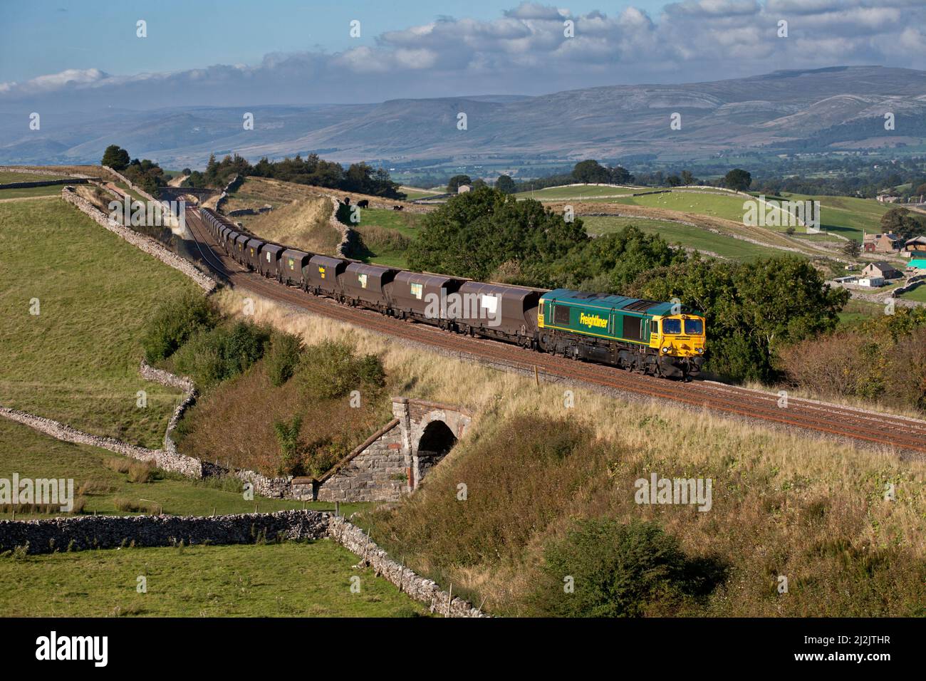 Freightliner class 66 locomotive 66951 hauling a merry go round coal ...