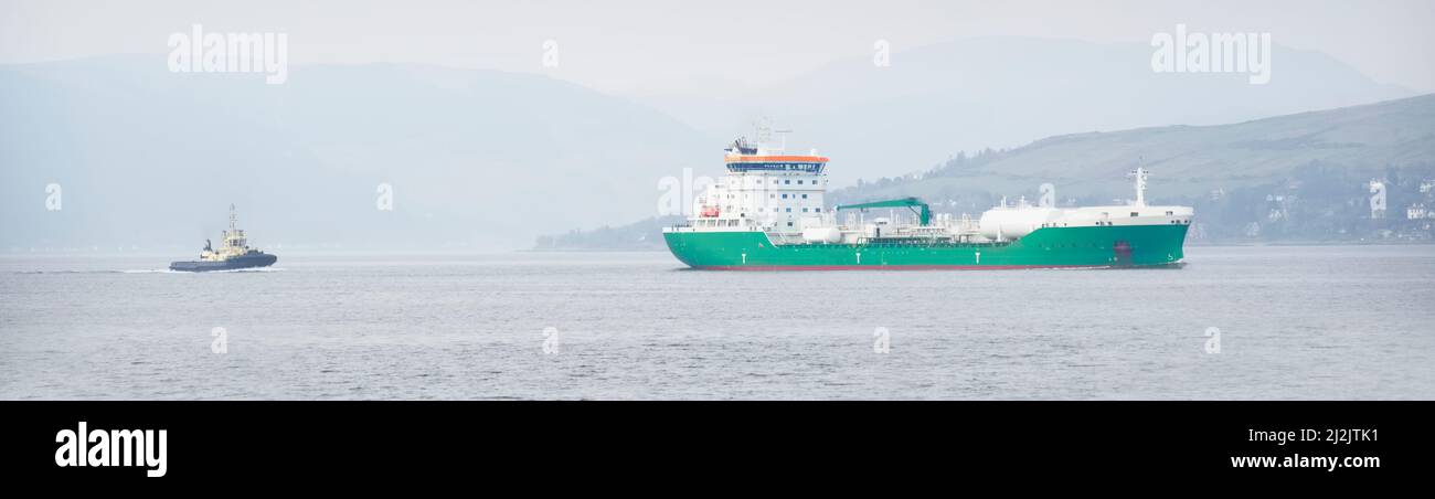 Ship transporting floating storage container platform in sea followed ...