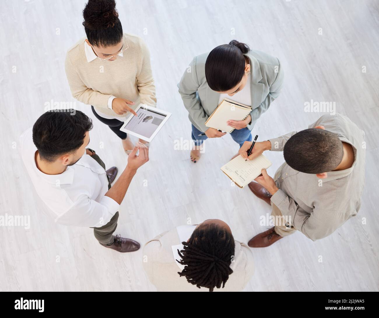 The best ideas happen naturally. High angle shot of a young and diverse ...