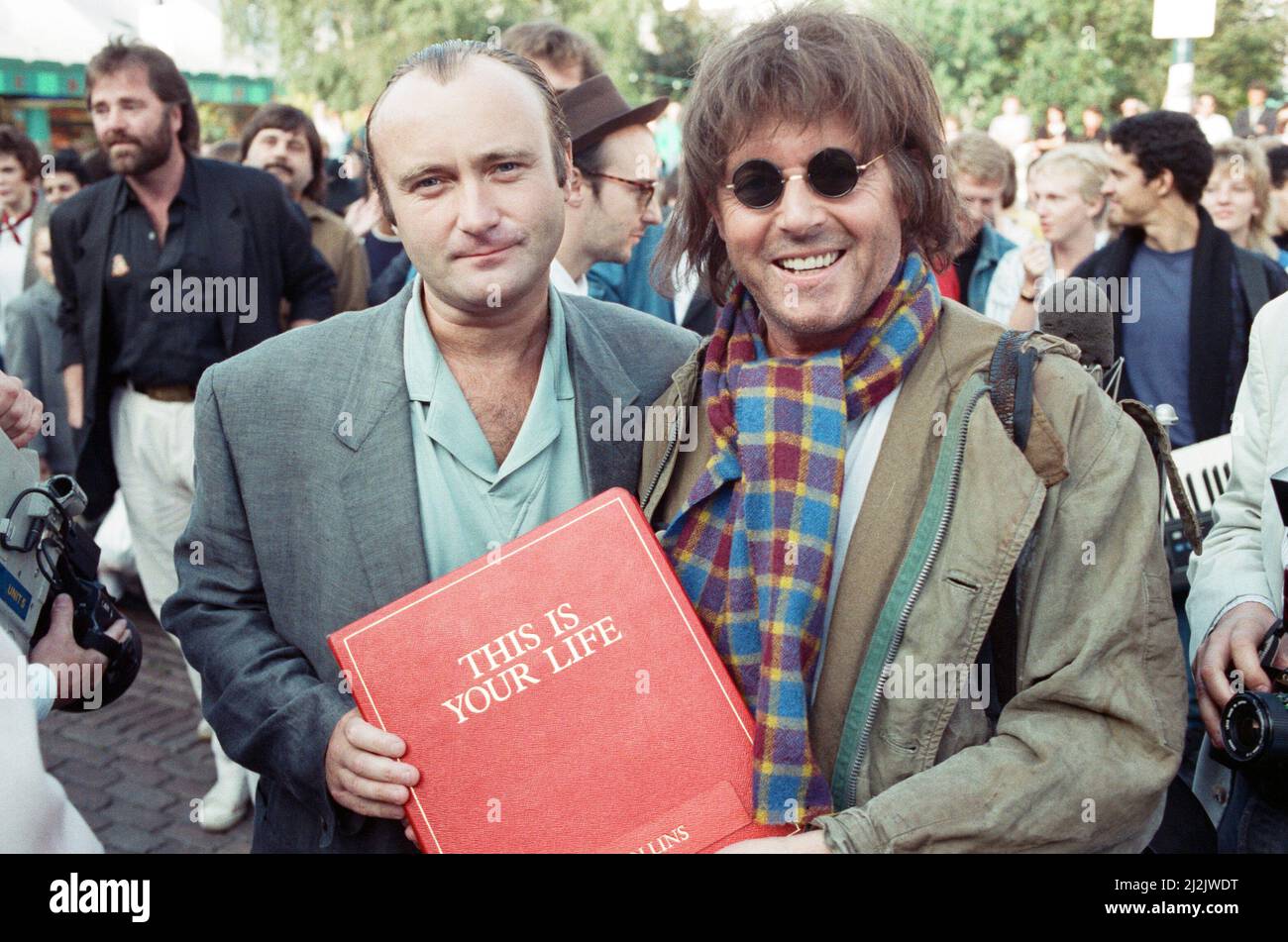 Michael Aspel surprises Phil Collins for the TV show "This is your Life ...