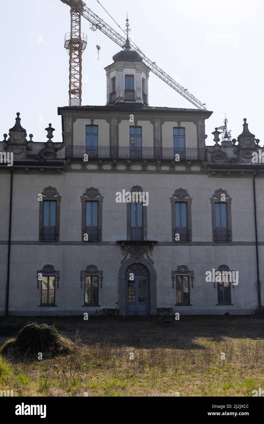 a facade of an ancient castle with large windows in italy Stock Photo ...