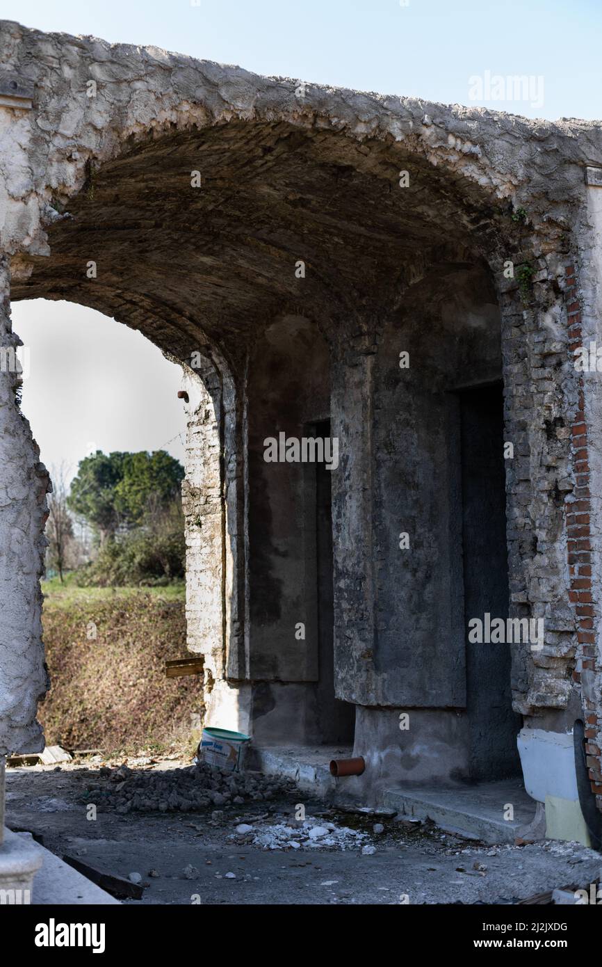 an old ruined stone brick arch in european castle italy Stock Photo - Alamy