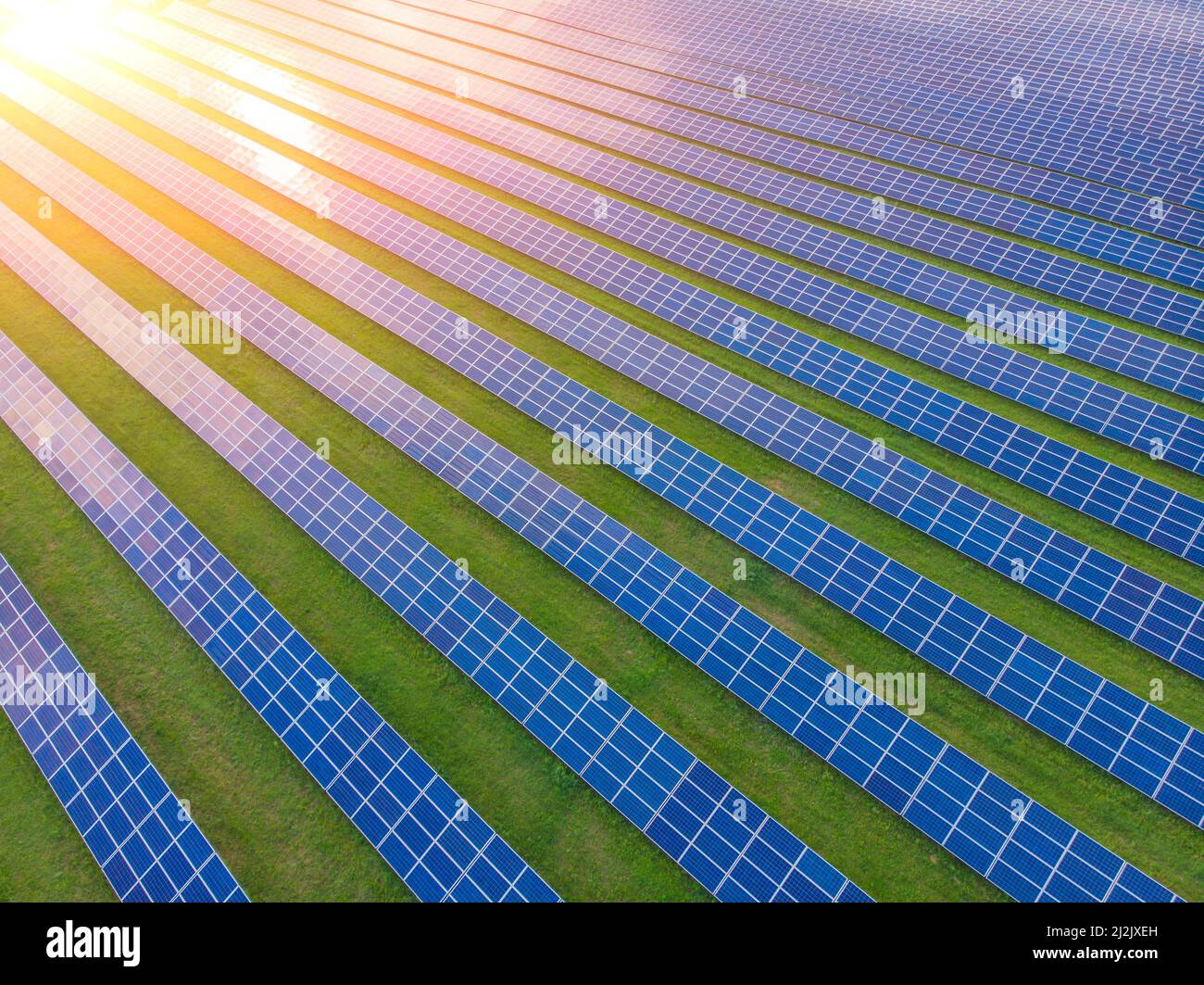 Drone aerial view of a photovoltaic solar system. Metallic blue solar ...