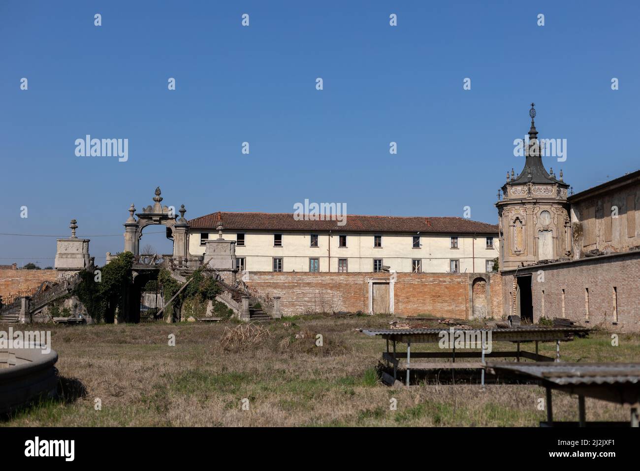 a facade of an ancient castle with large windows in italy Stock Photo ...