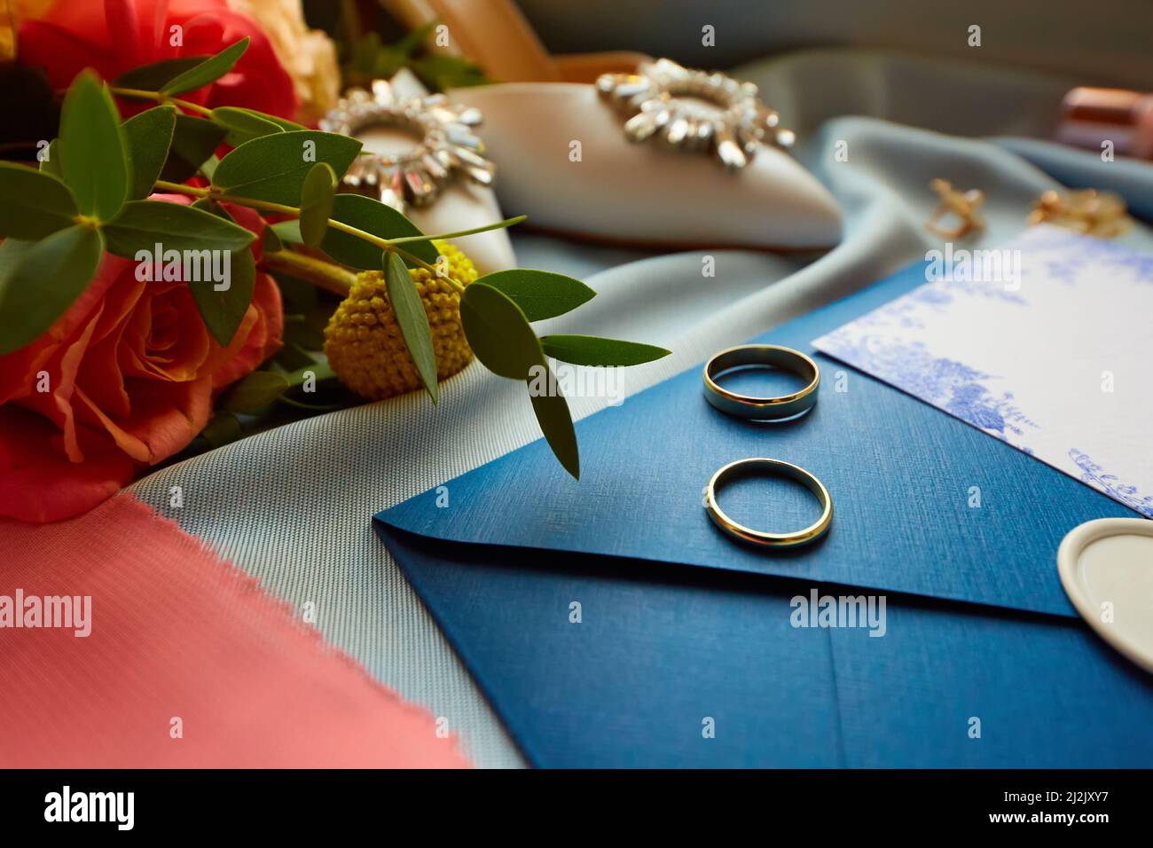 Wedding rings and wedding invitation. Shallow dof Stock Photo - Alamy