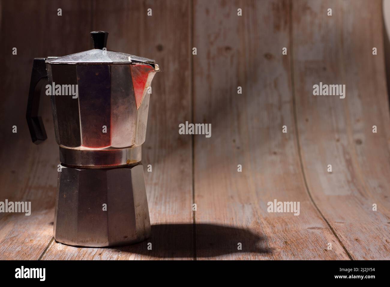 used greca coffee pot on light vintage wood background Stock Photo - Alamy