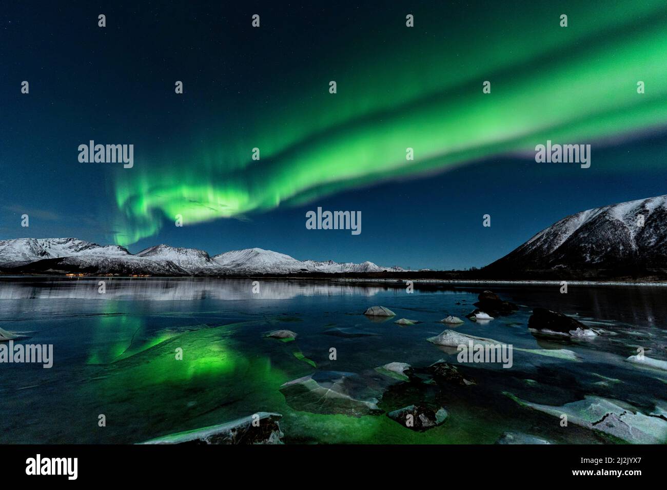 Milky way galaxy with aurora borealis northern lights frozen landscape ...
