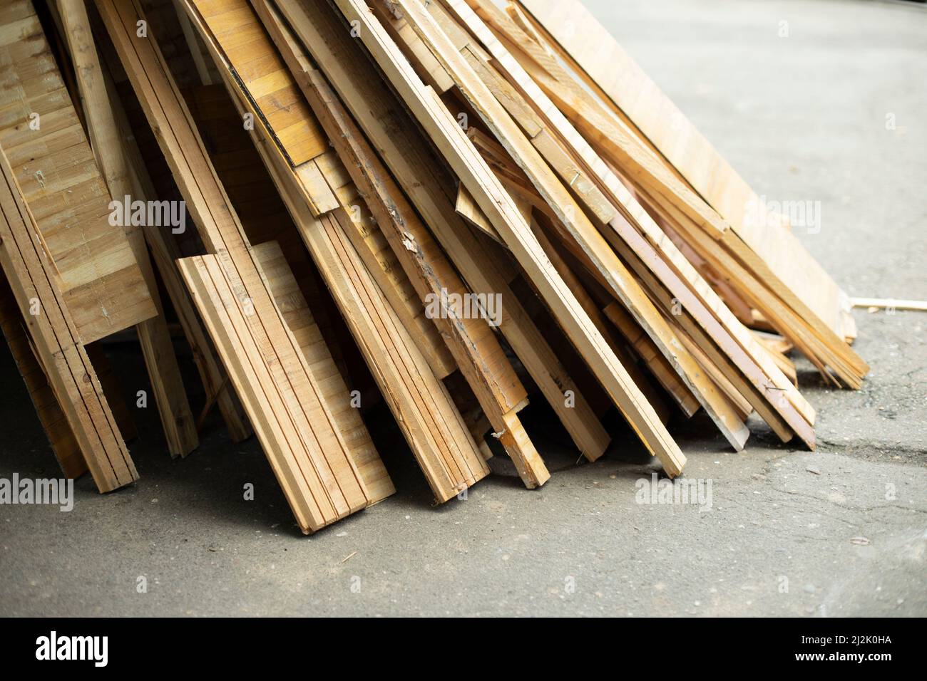 Broken parquet. Waste after repair. Boards from floor. Construction ...