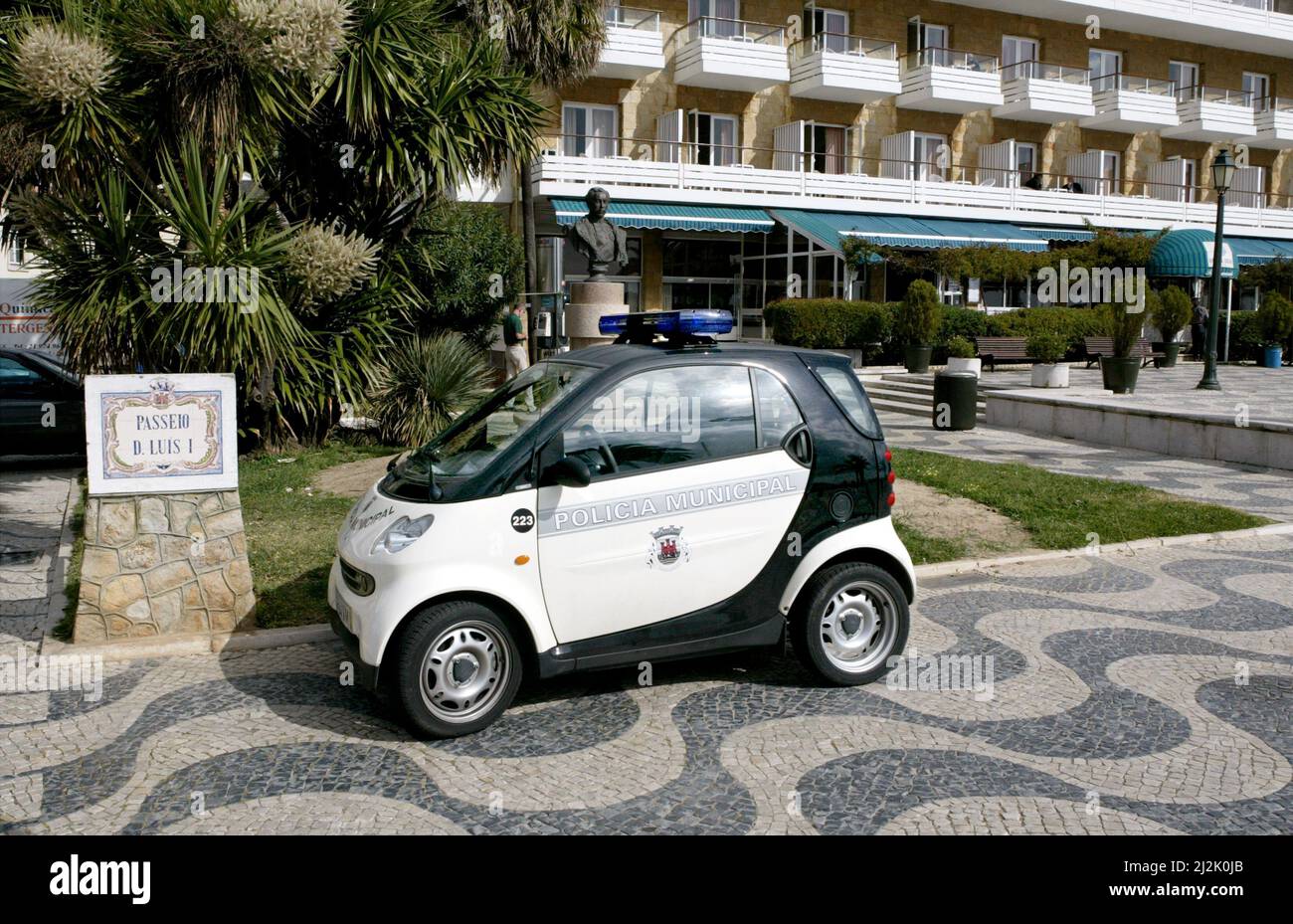 The port city of Cascais, Portugal. A mini police car Stock Photo - Alamy
