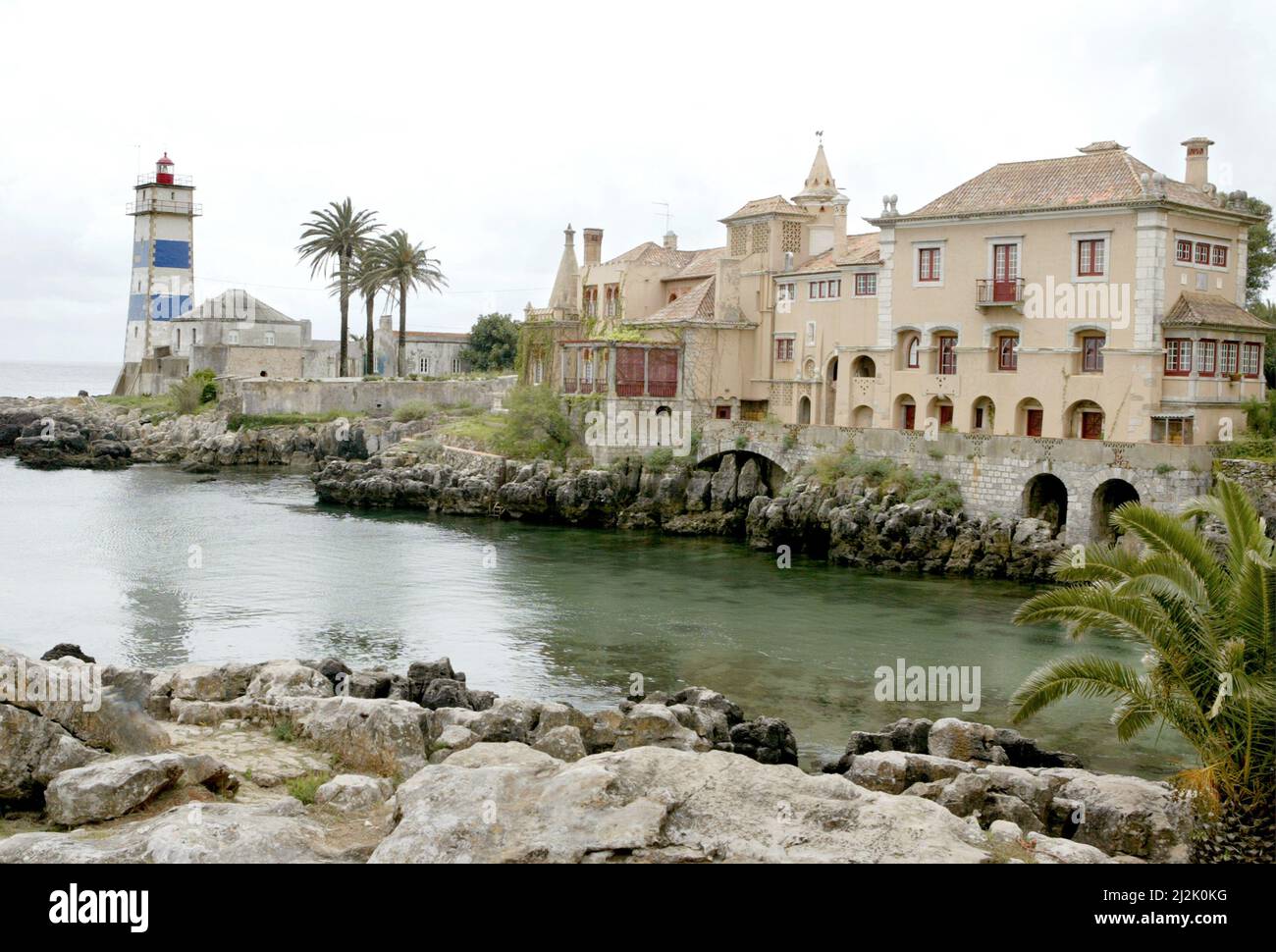The port city of Cascais, Portugal. Buildings and a lighthouse on the ...