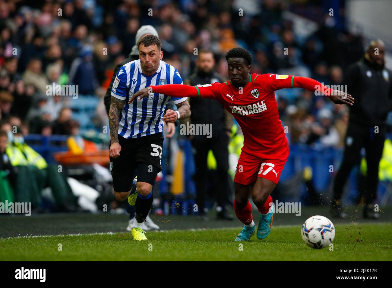 Jack Hunt #32 of Sheffield Wednesday and Paul Osew #37 of AFC Wimbledon ...