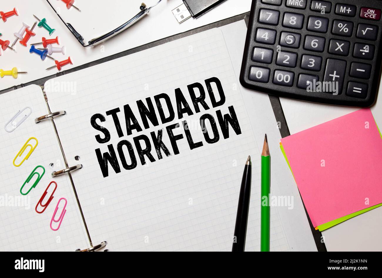 STANDARDS man hand notebook and other office equipment such as computer ...