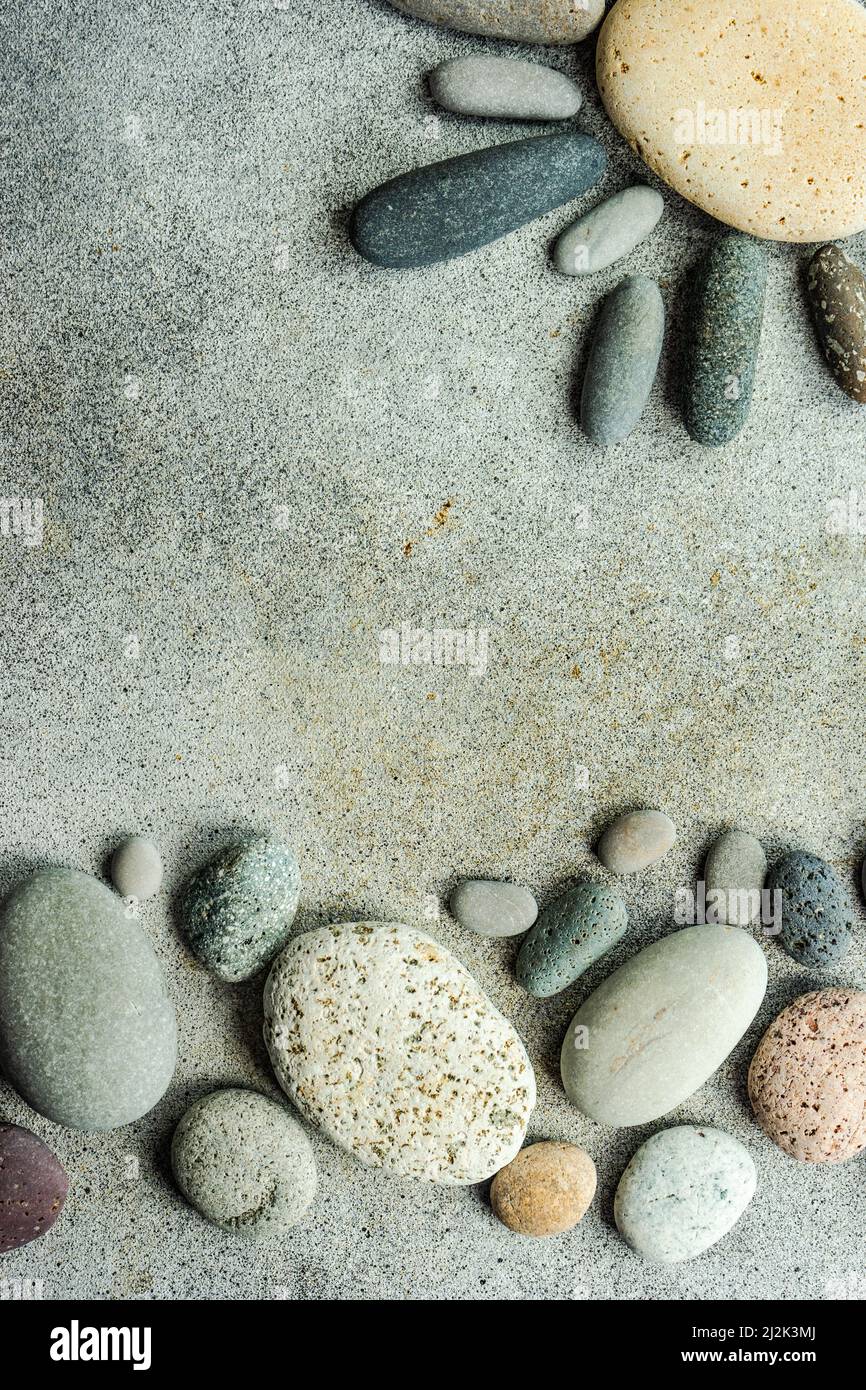 Overhead view of assorted pebbles on a table arranged in the shape of ...