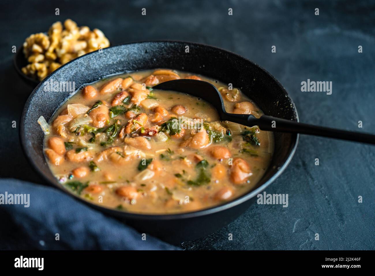 Close-up of a bowl of traditional Georgian lobio with walnuts Stock ...