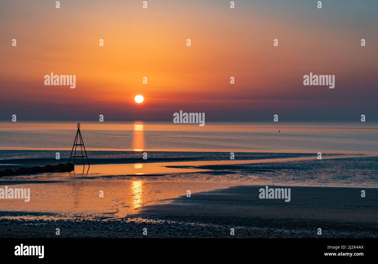Sunset over Hunstanton beach on the North Norfolk Coast Stock Photo - Alamy