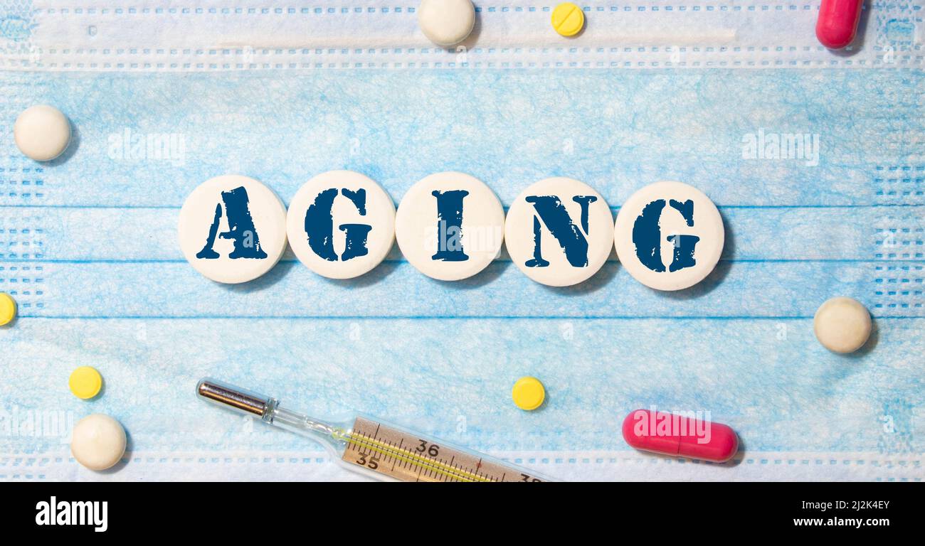 Ageing - word from wooden blocks with letters, growing old senescence ...
