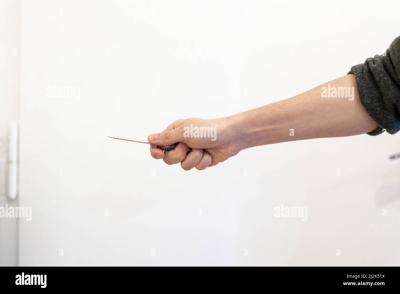 A shot of a man holding a stitching awl on a white background Stock ...