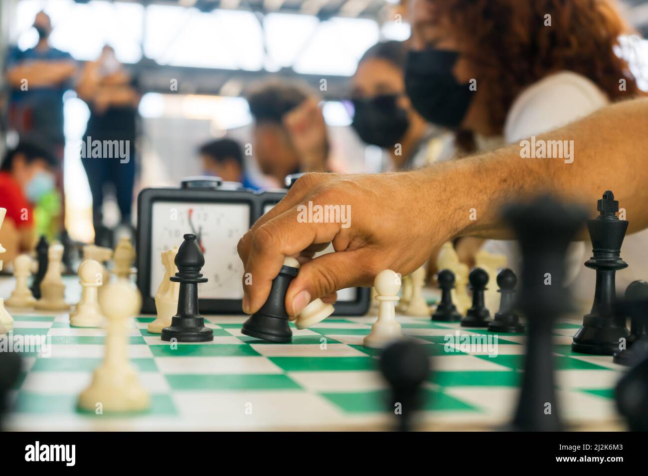 Closeup of the hand of a Latin mature man attacking and removing a ...