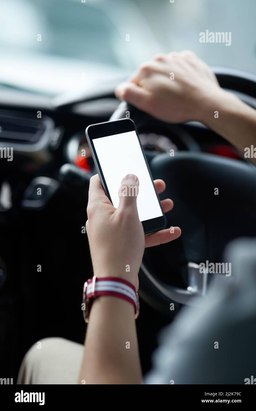 Distracted driving is a potential danger. Closeup shot of an ...