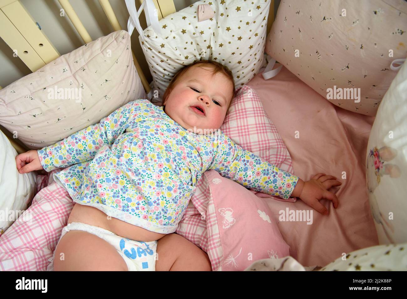 Happy 9 month old baby in diaper hi-res stock photography and images ...