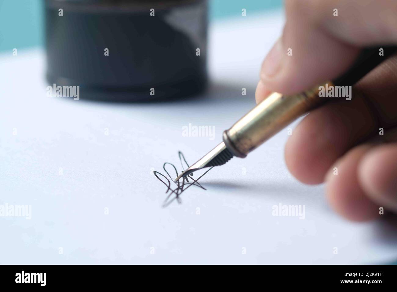 Close up of man hand writing a letter with fountain pen Stock Photo - Alamy