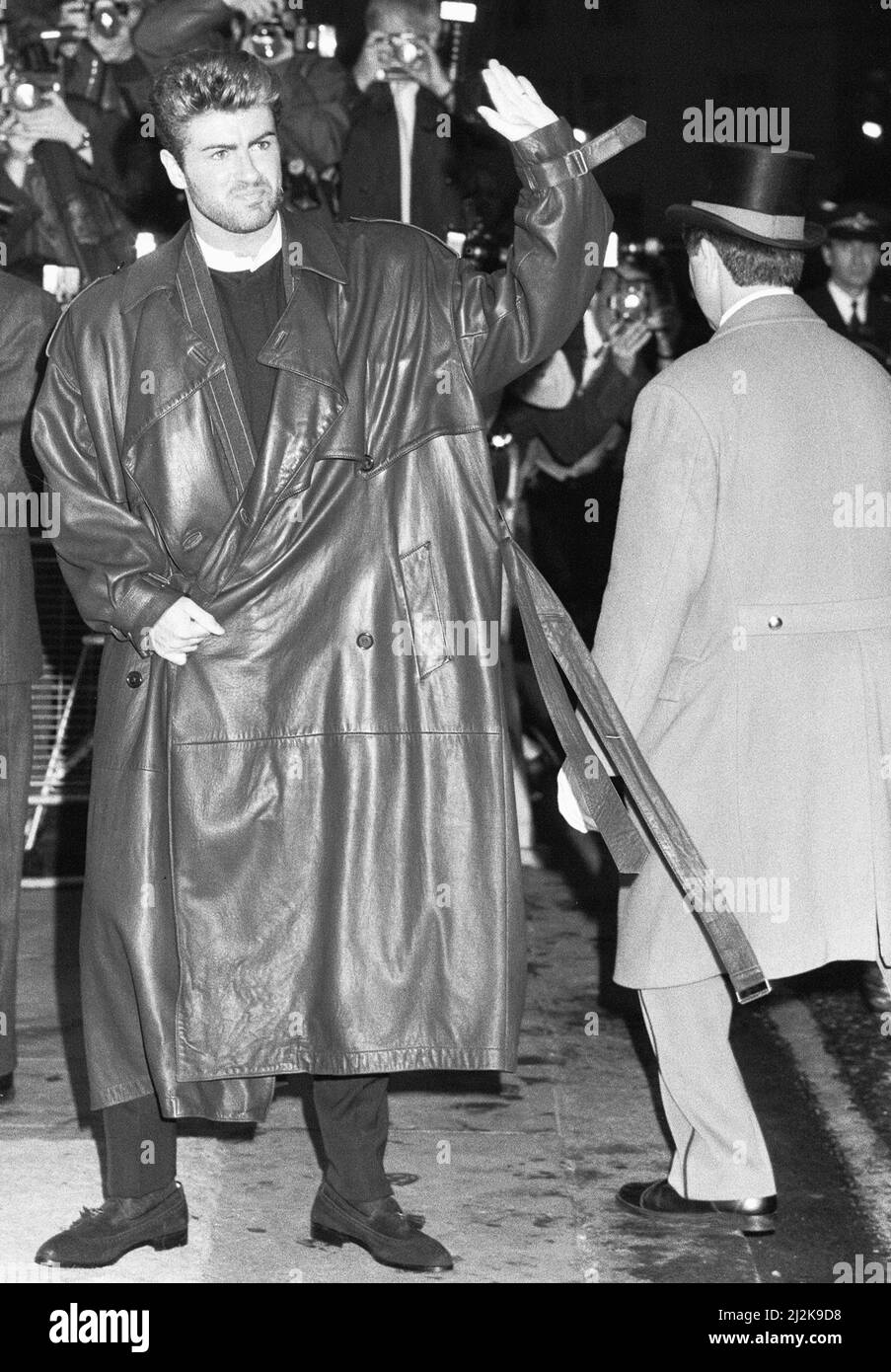 George Michael waves to fans outside the Savoy Hotel, where the launch ...