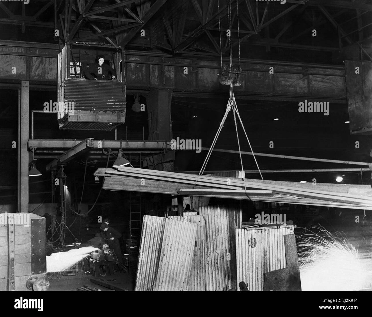 Olive Taylor, the female crane operator. 4th December 1940 Stock Photo ...