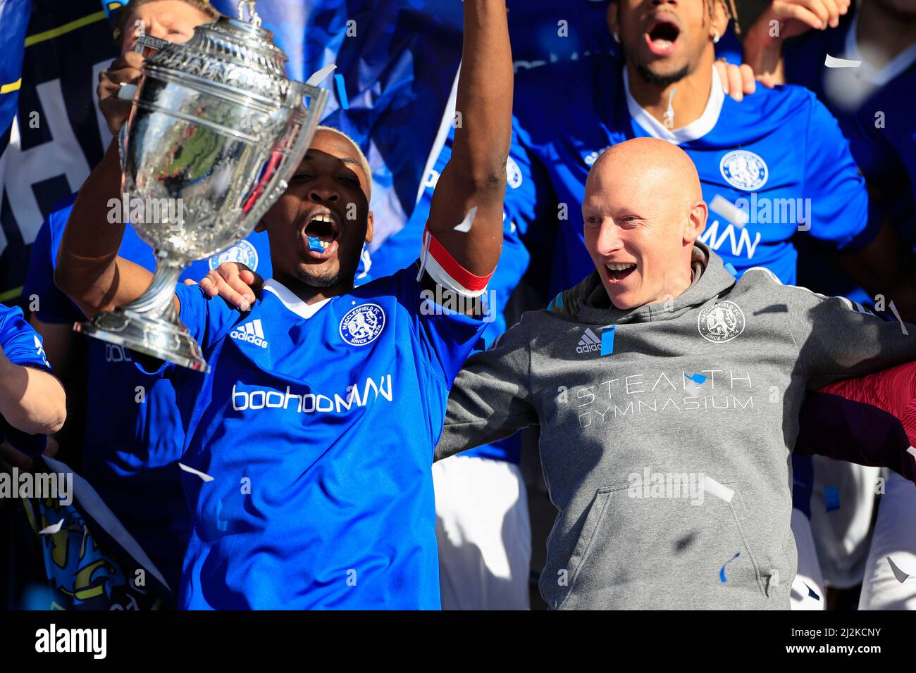 Laurent Mendy of Macclesfield FC and club manager Danny Whittaker lift ...