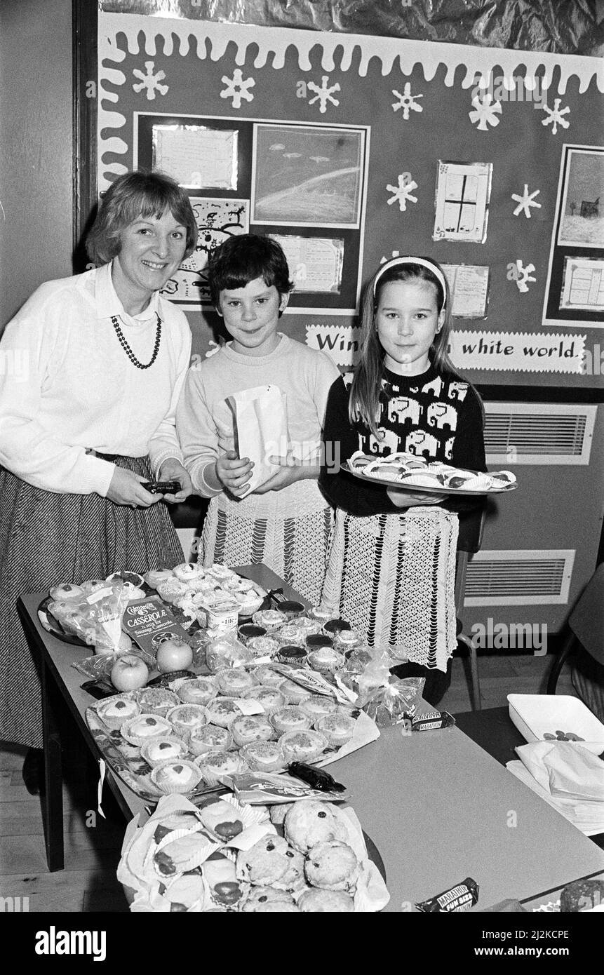 Ten-year-old Sarah Hanson (centre) serves customer Mrs Irena Wegrzyn at ...